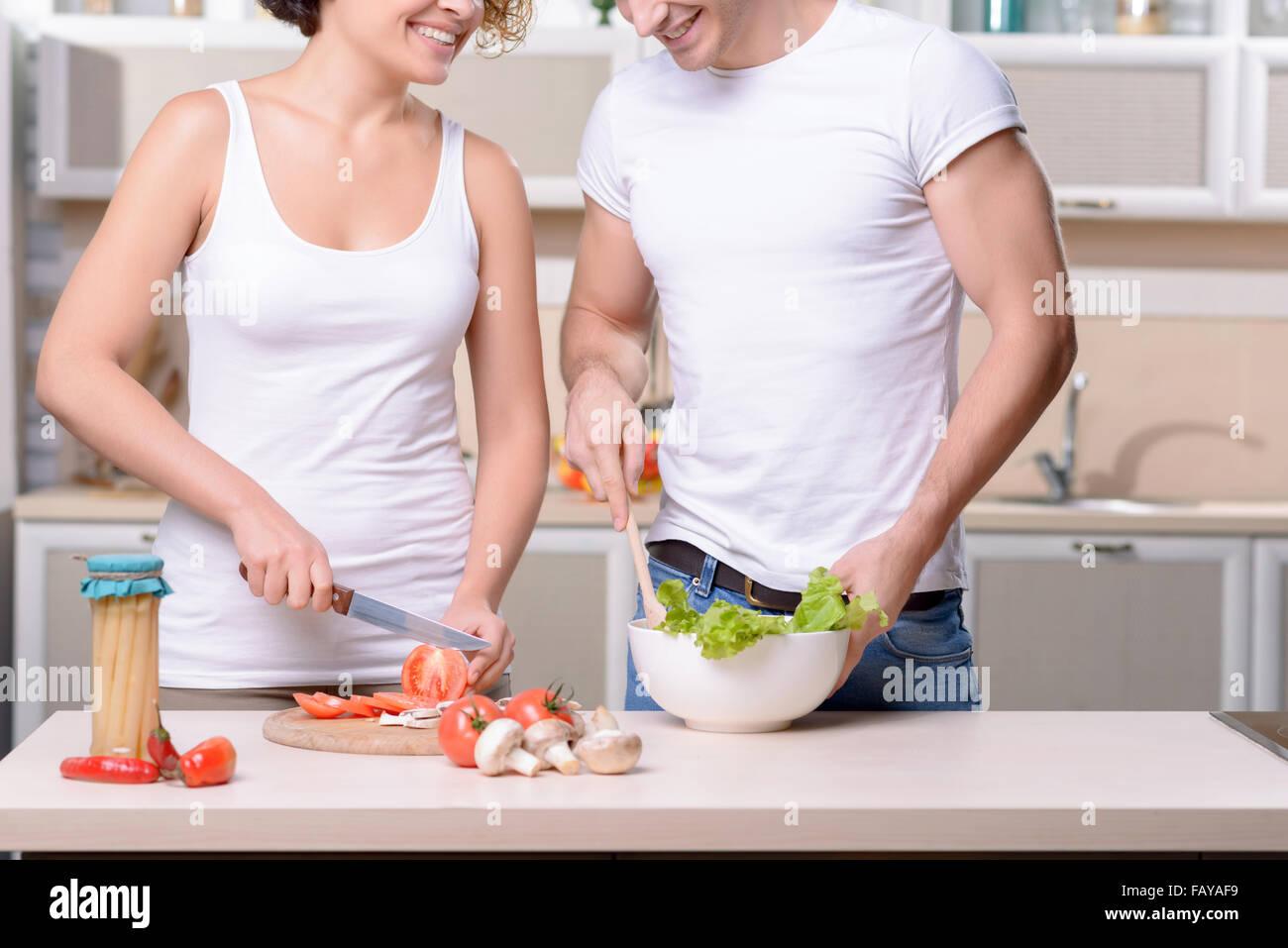 Nice couple cooking in the kitchen Stock Photo - Alamy