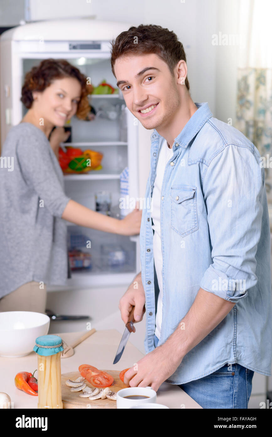 Loving couple cooking together Stock Photo - Alamy