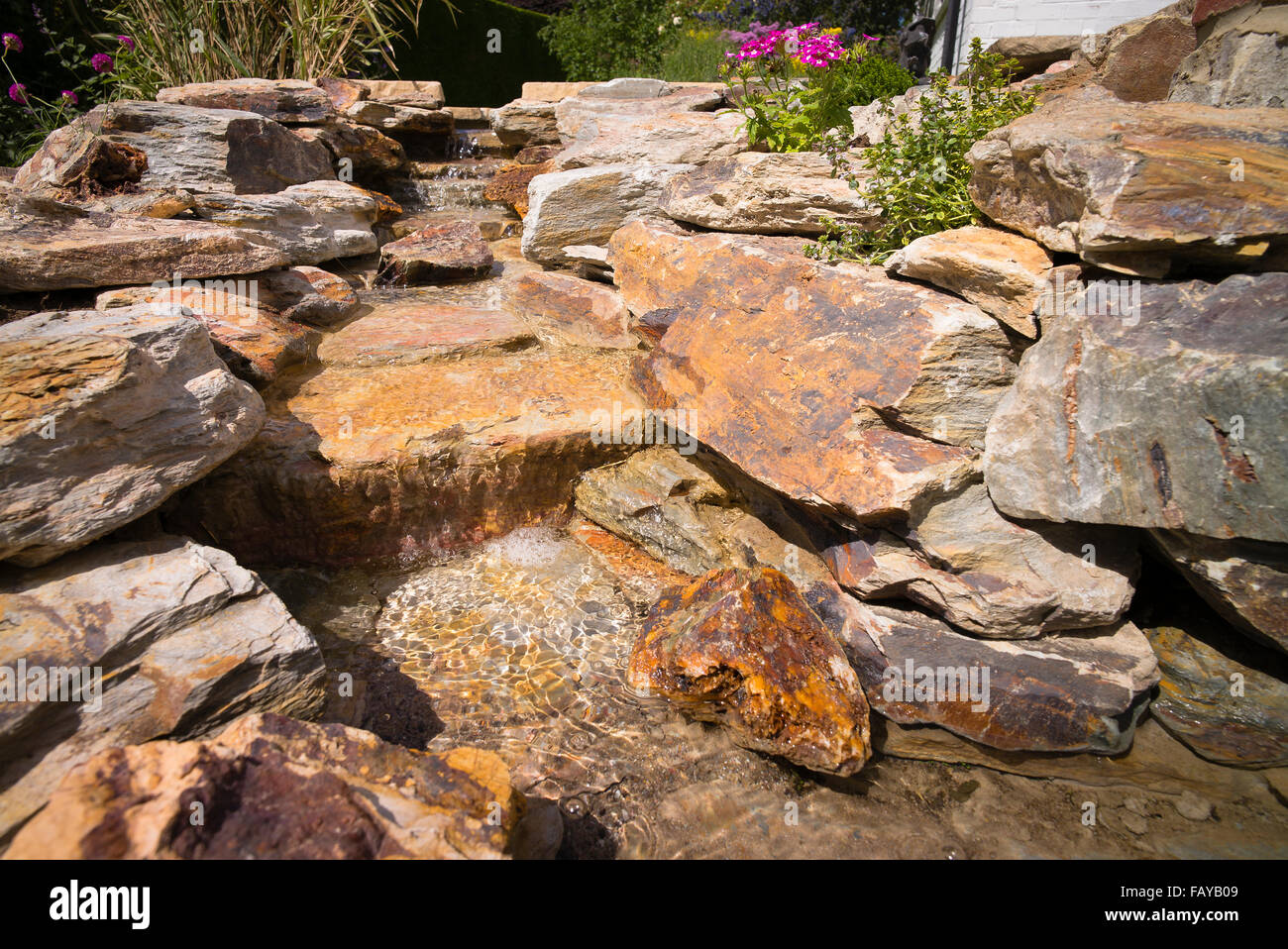 A newly constructed waterfall and rockery using Welsh slate Stock Photo ...