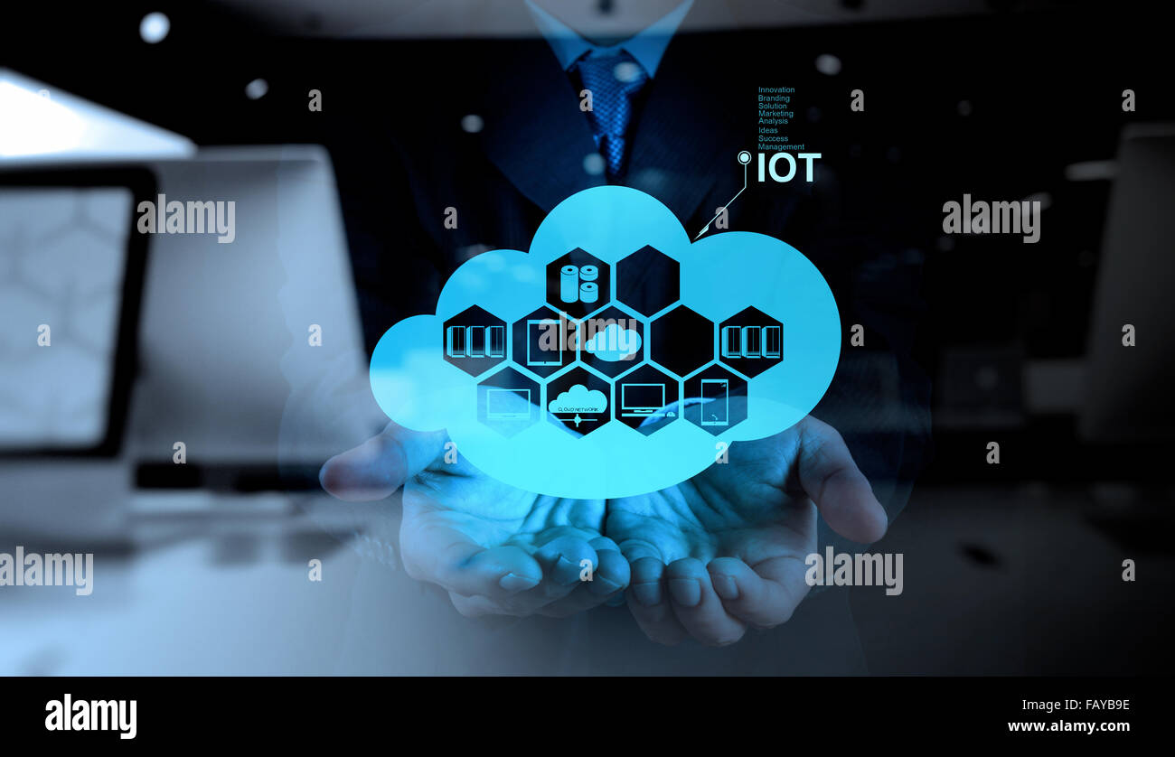 double exposure of hand showing Internet of things (IoT) word diagram ...