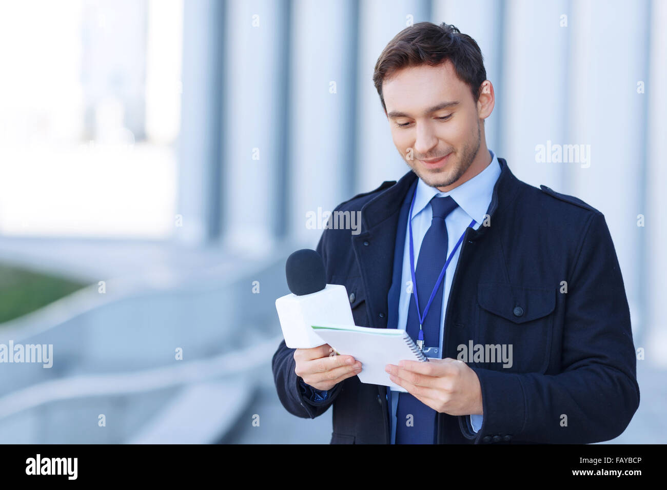 Journalist is reading his current strategy written in notepad Stock ...