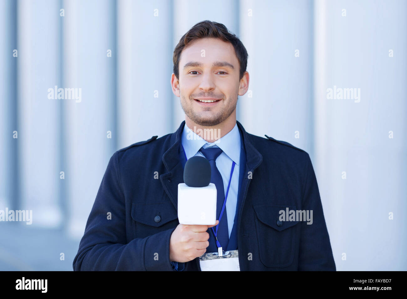 Smiling journalist is ready to record reportings Stock Photo - Alamy