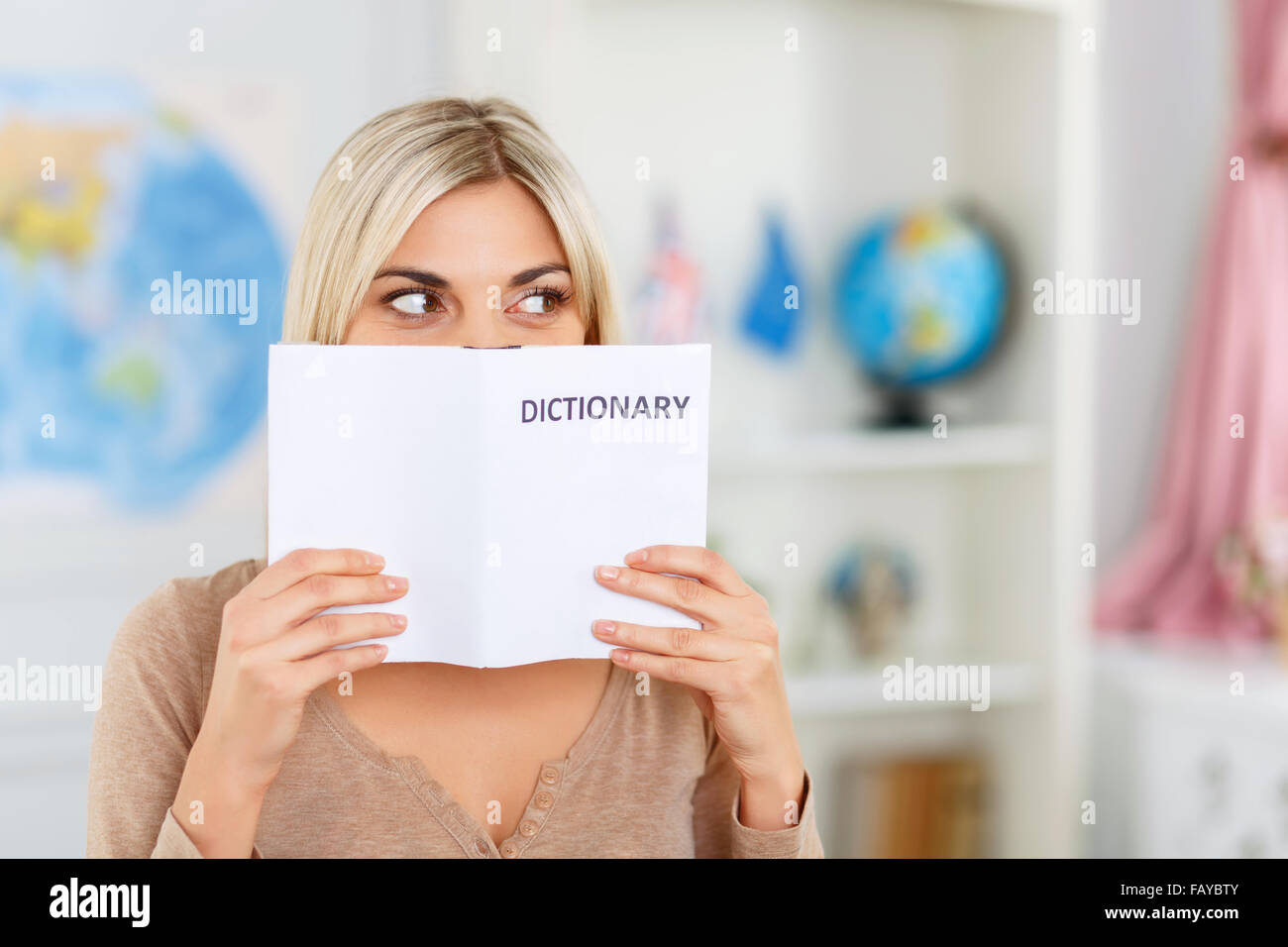Nice girl reading dictionary hi-res stock photography and images - Alamy