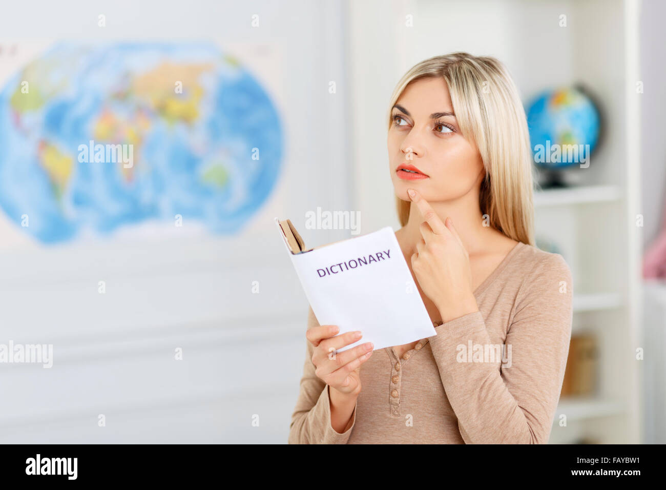 Nice girl reading dictionary hi-res stock photography and images - Alamy