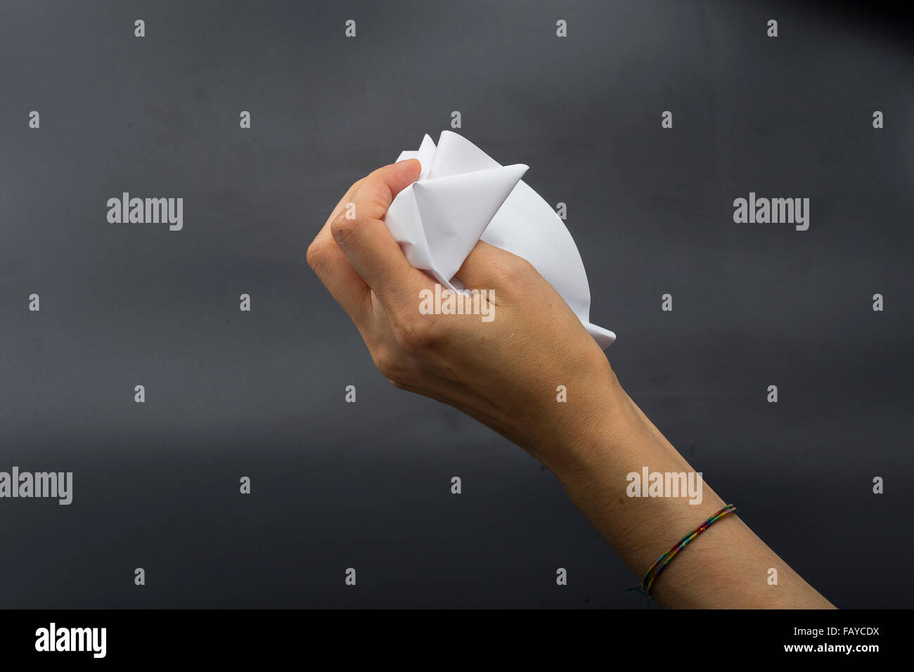 Hand crumpling hi-res stock photography and images - Alamy