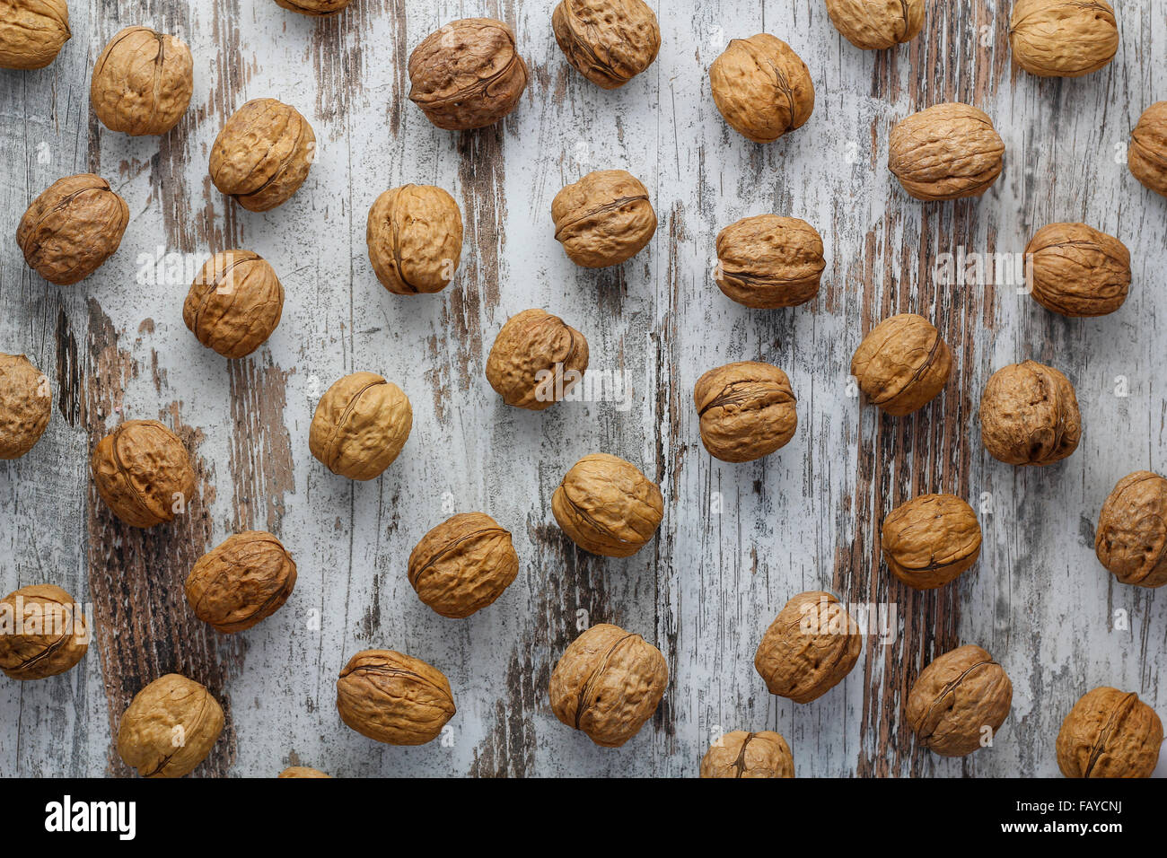 Walnuts in a wood background Stock Photo - Alamy
