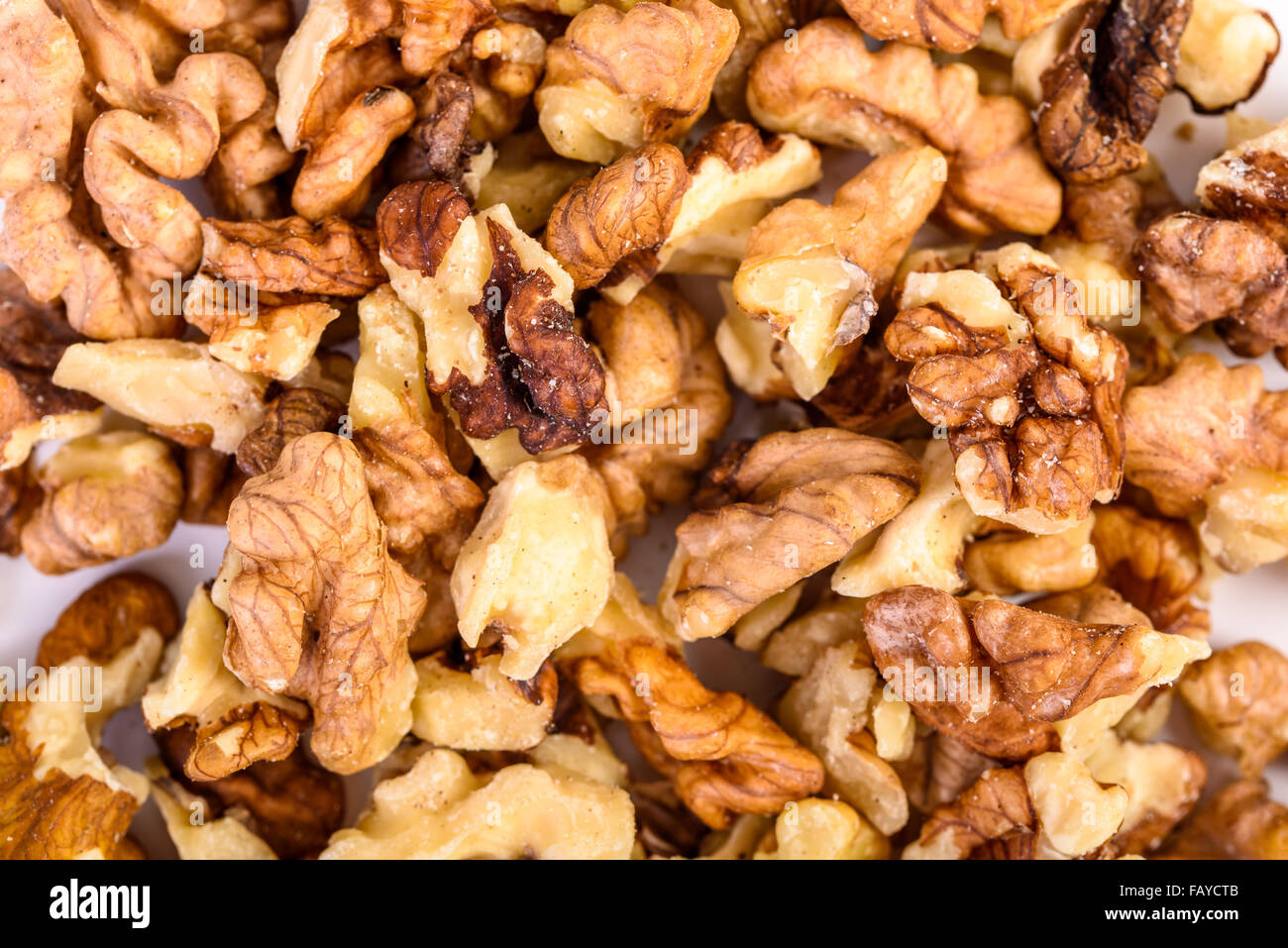Pile Of Walnuts Close Up Stock Photo - Alamy