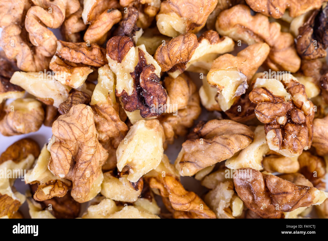 Pile Of Walnuts Close Up Stock Photo - Alamy