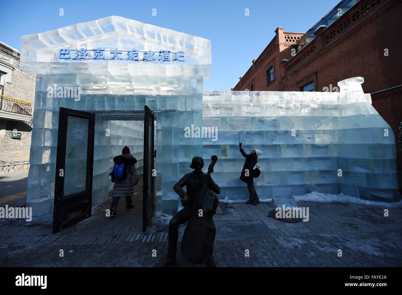 Harbin, China's Heilongjiang Province. 6th Jan, 2016. A tourist walks ...