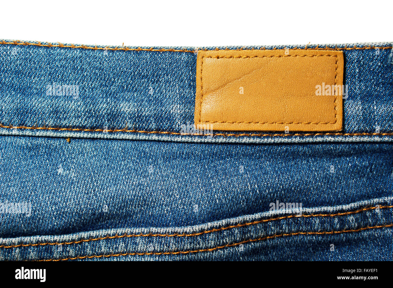 Blank leather label on blue jeans isolated on white background Stock ...