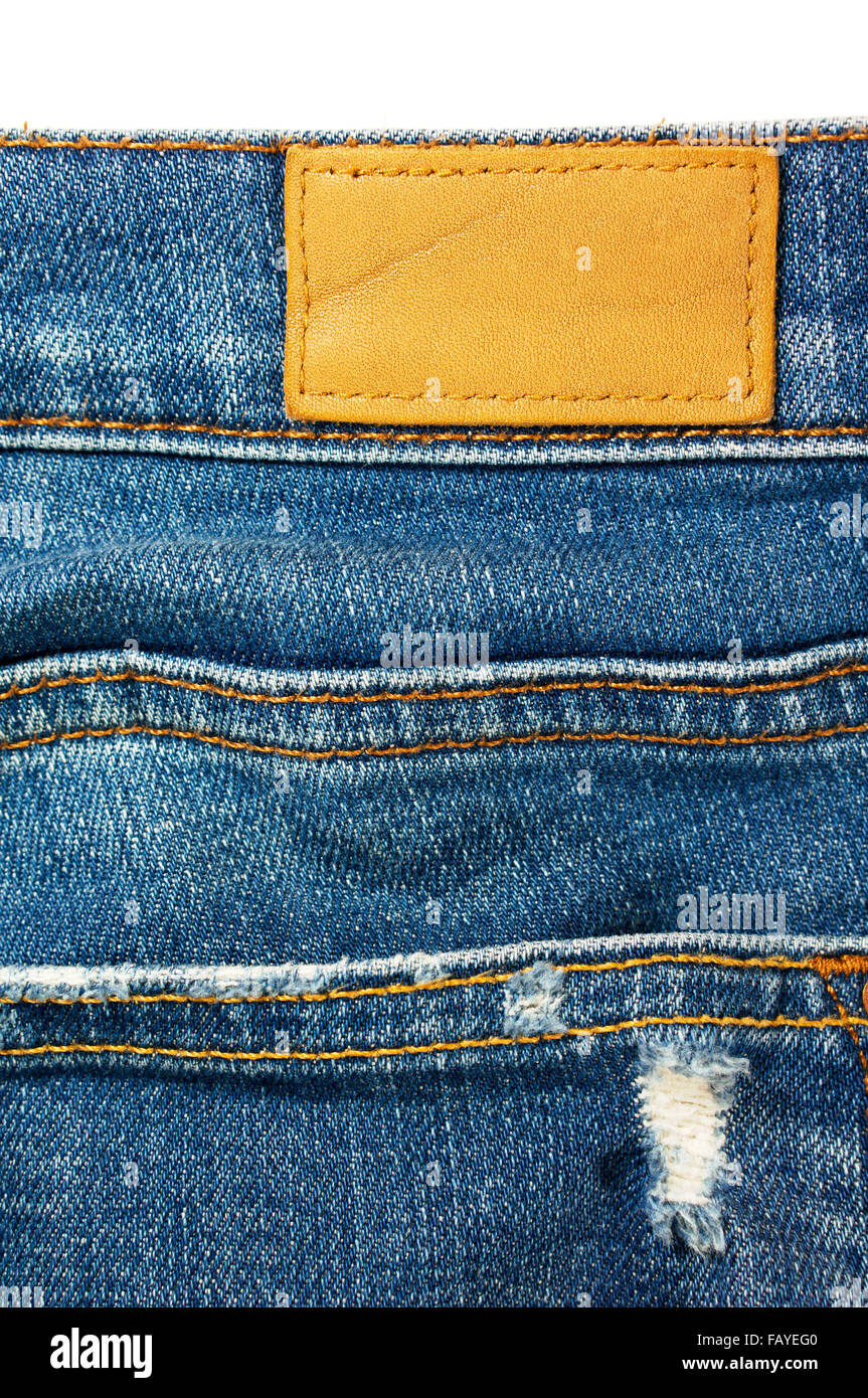 Closeup blue jeans with blank leather label isolated on white ...