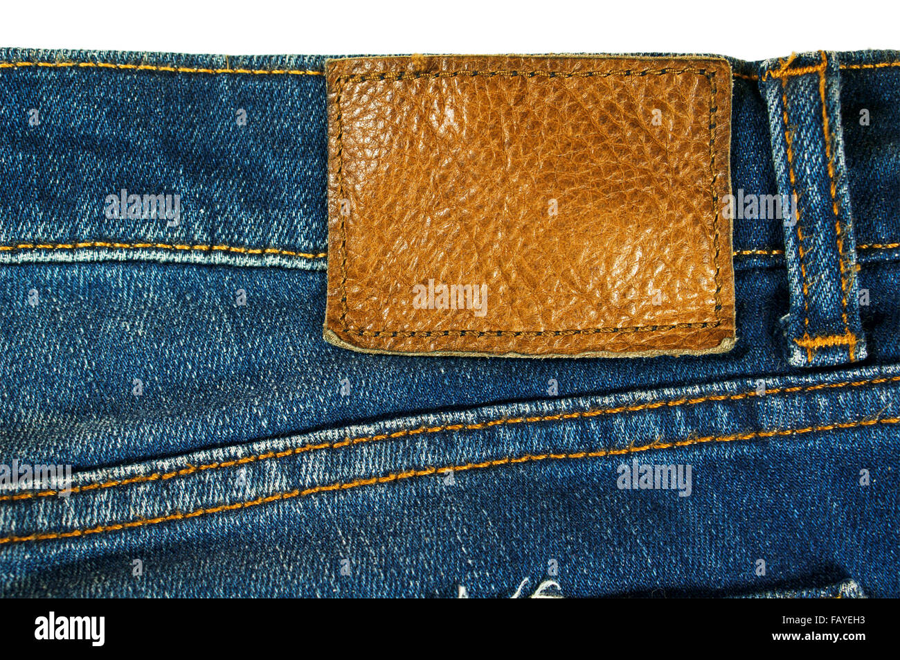 Leather label closeup on blue jeans isolated on white background Stock ...