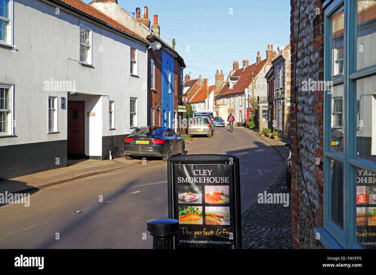 A view of the A149 coast road running through the North Norfolk village ...