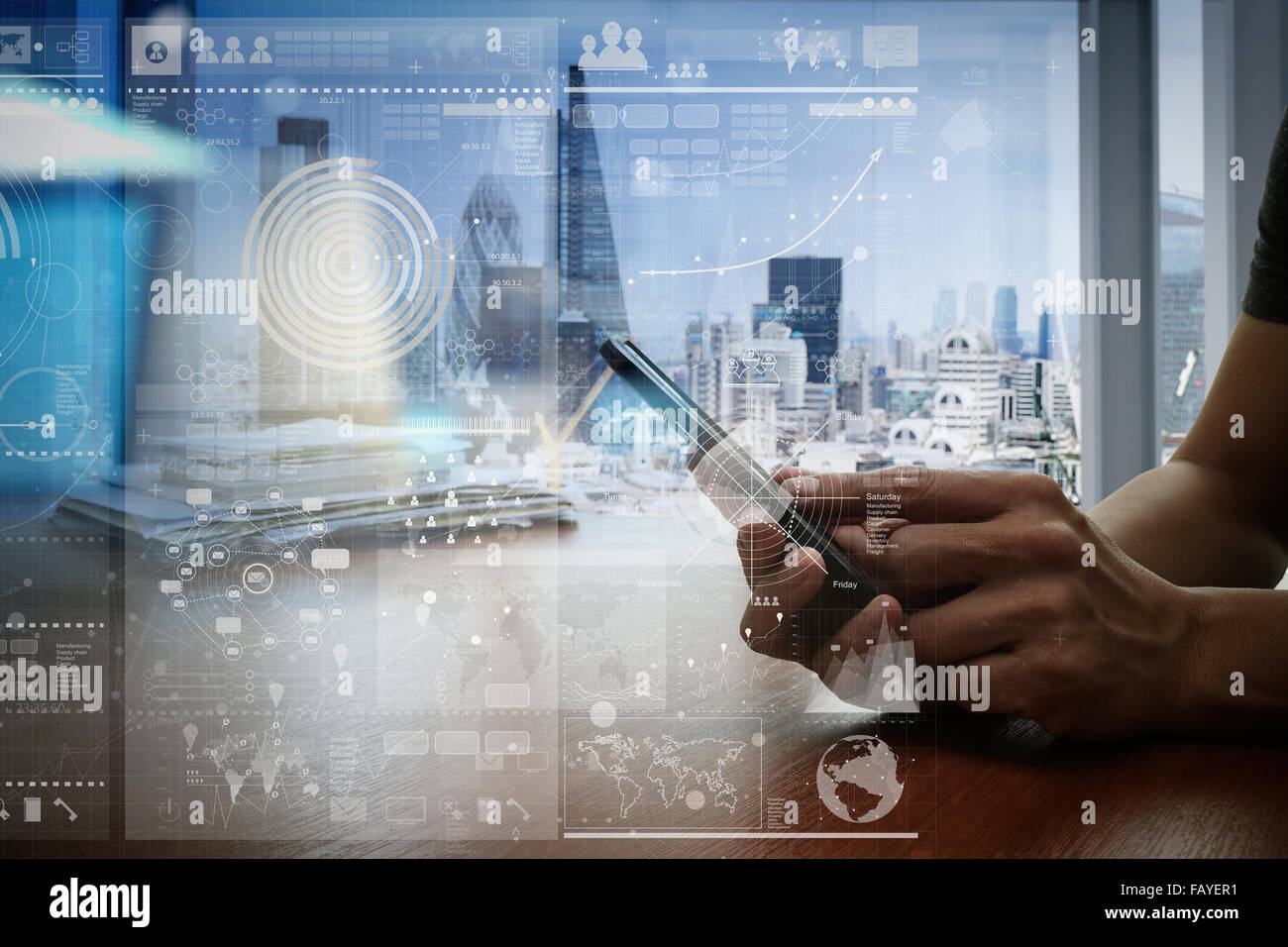 designer hand working and smart phone and laptop on wooden desk in ...