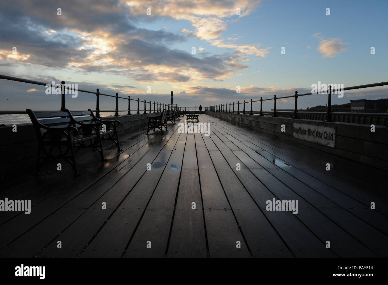 A beautiful sunrise in the sky above the pier at Littlehampton in West ...