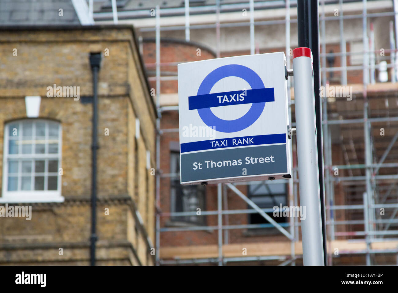 A taxi rank sign is seen on St Thomas Street, London Stock Photo - Alamy