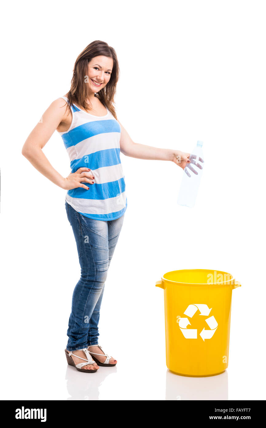 Beautiful young woman doing recycling, isolated over white background ...