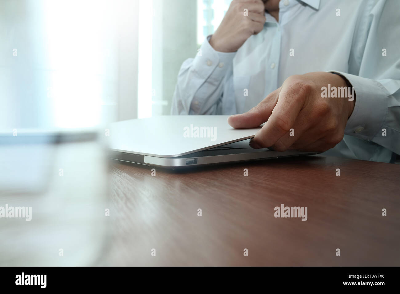 close up of business man hand working on laptop computer with social ...