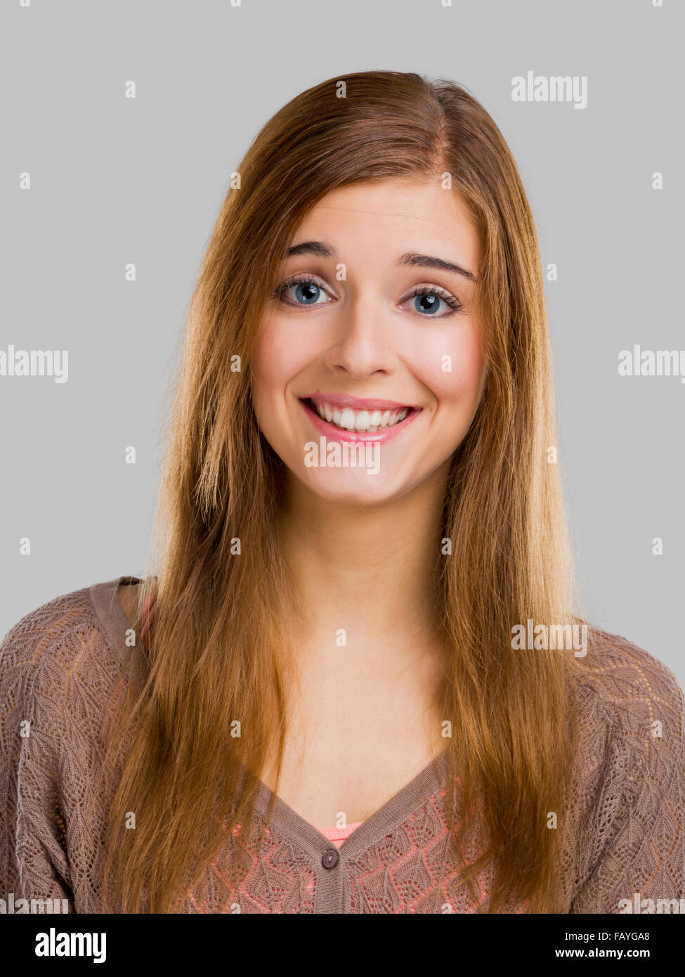 Beautiful and happy woman smiling over a gray background Stock Photo ...