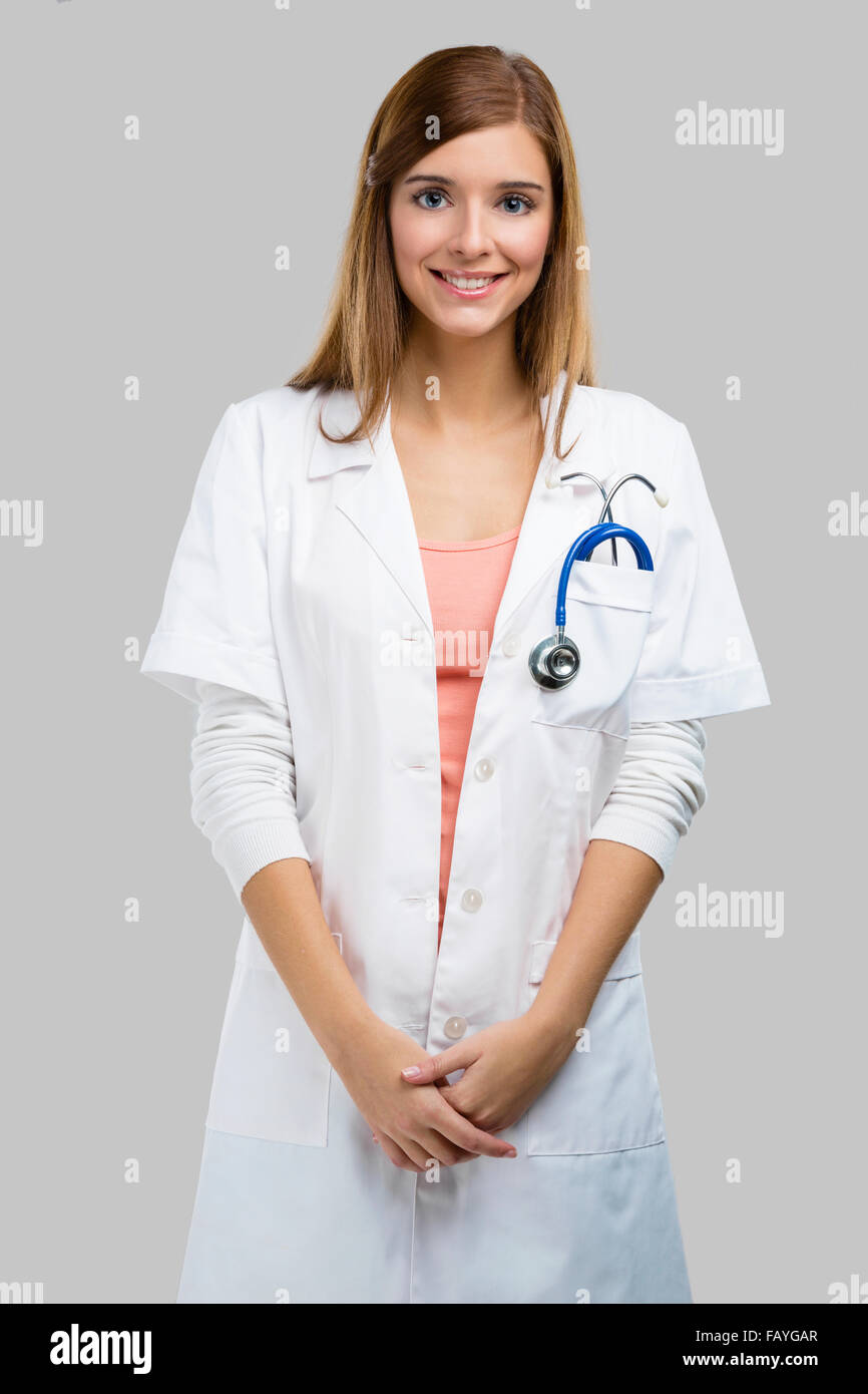 Beautiful and attractive female doctor, isolated over a white ...