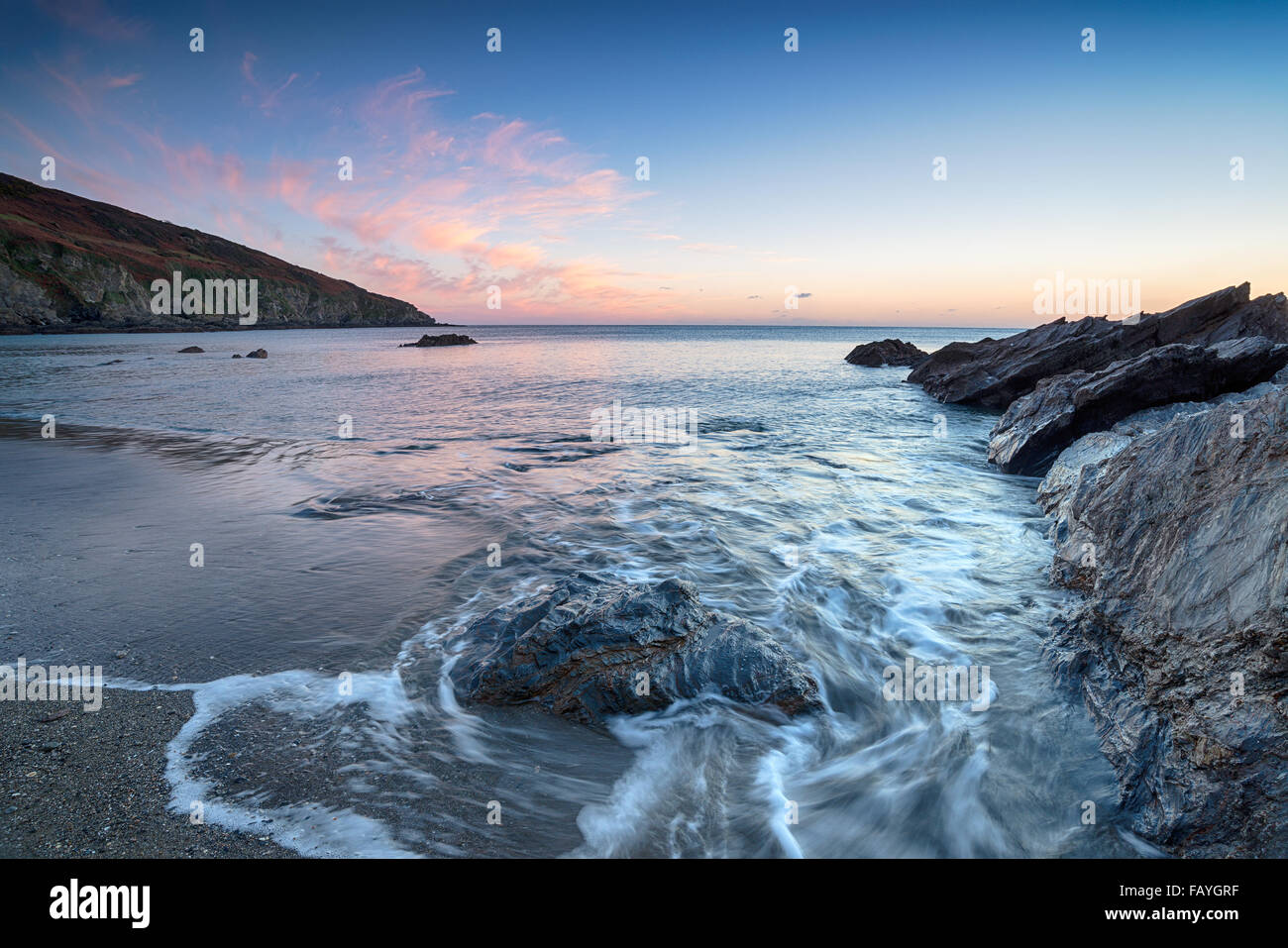 Dusky evening sky over Hemmick Beach on the south coast of Cornwall ...