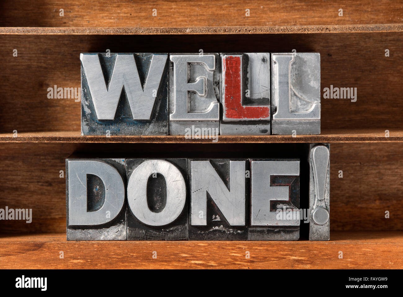 well done exclamation phrase made from metallic letterpress type on ...