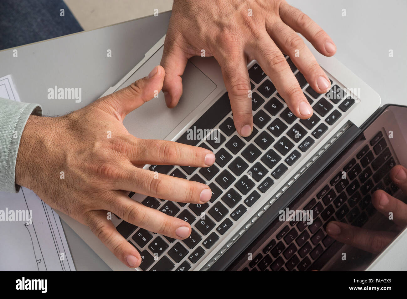 Fingers typing on a keyboard Stock Photo - Alamy