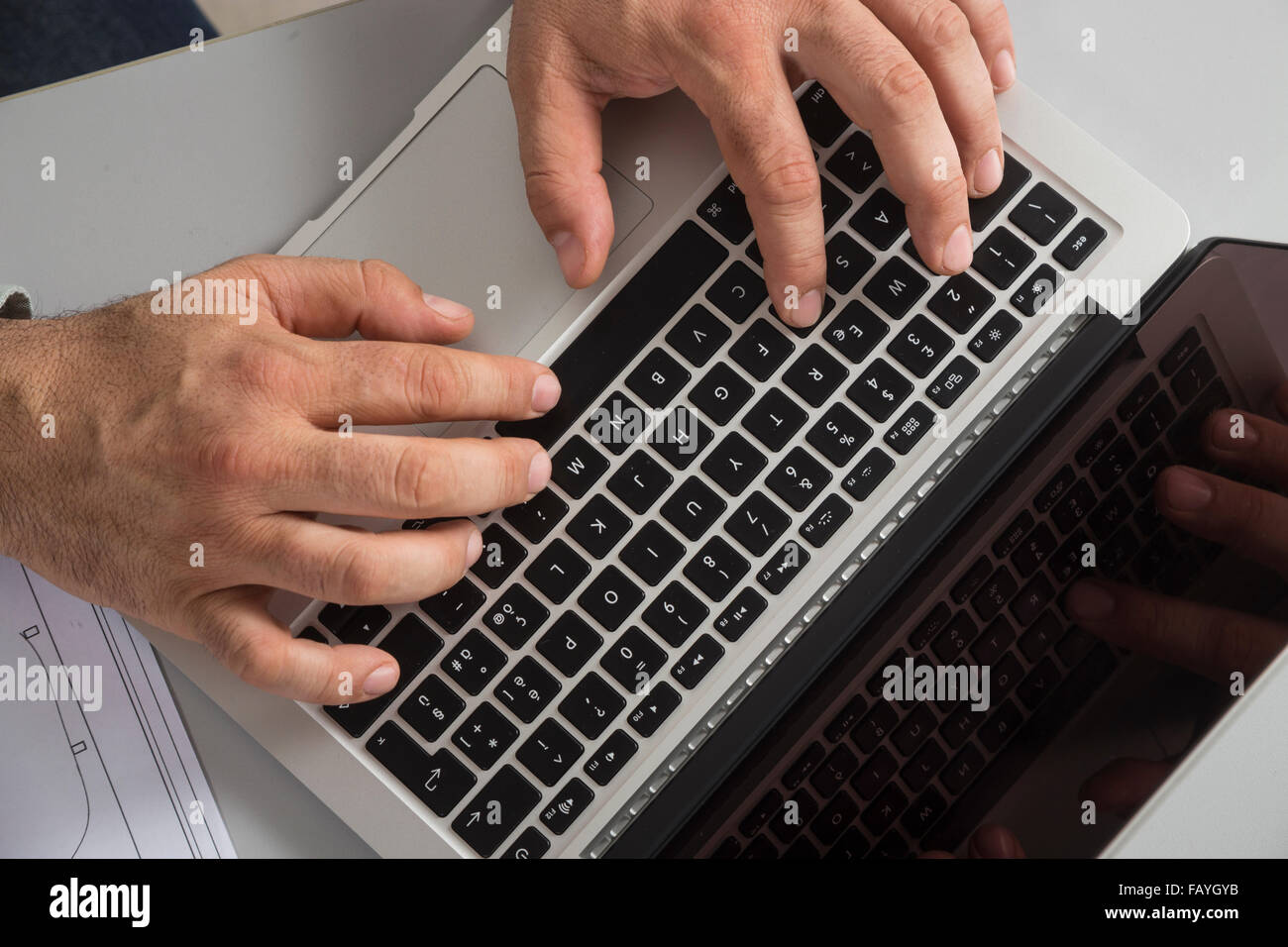 Fingers typing on a keyboard Stock Photo - Alamy
