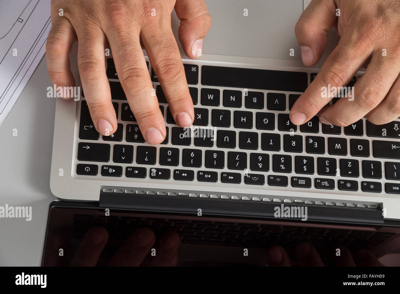 Fingers typing on a keyboard Stock Photo - Alamy