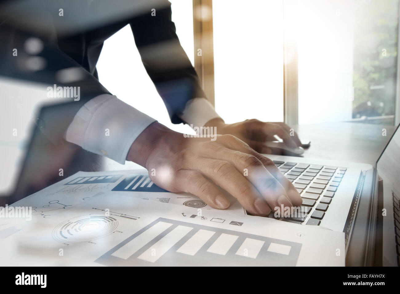 Double exposure of business man hand working on blank screen laptop ...