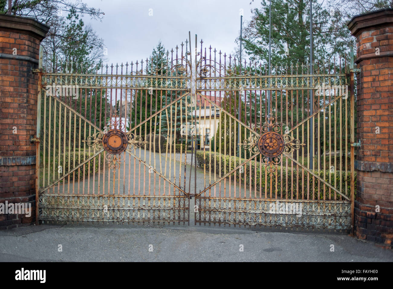Old worn out ornamental iron gate Stock Photo - Alamy
