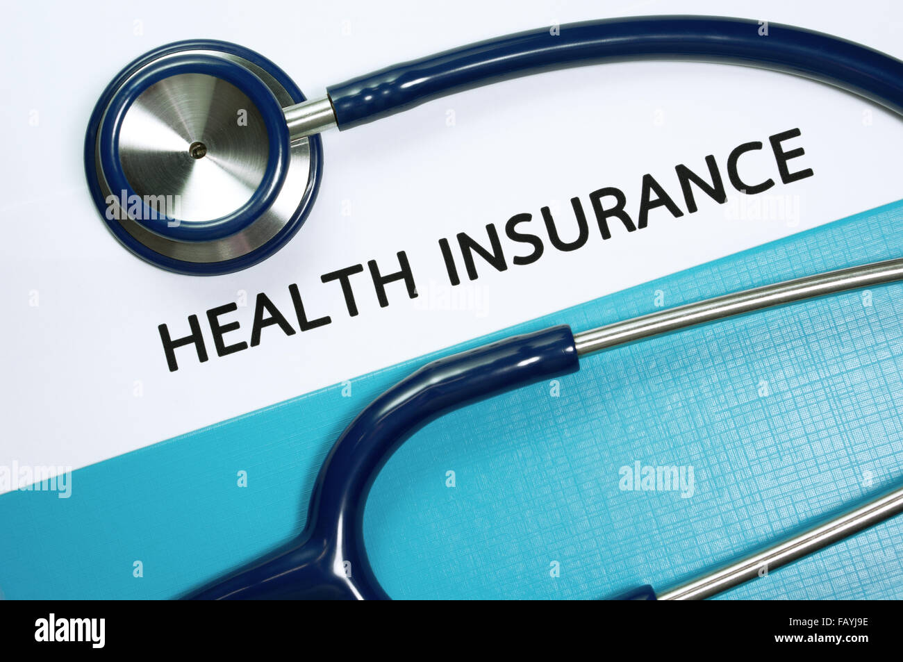 Health insurance document in folder with stethoscope Stock Photo - Alamy