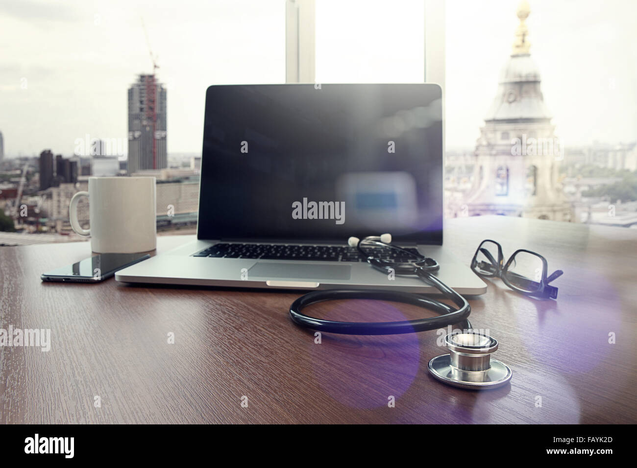Doctor workspace with laptop computer in medical workspace office and ...