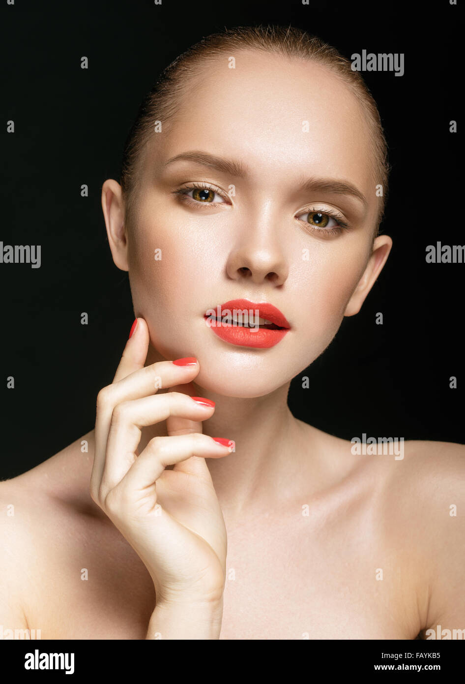 Close-up portrait of beautiful girl with clear healthy skin. Looking at ...