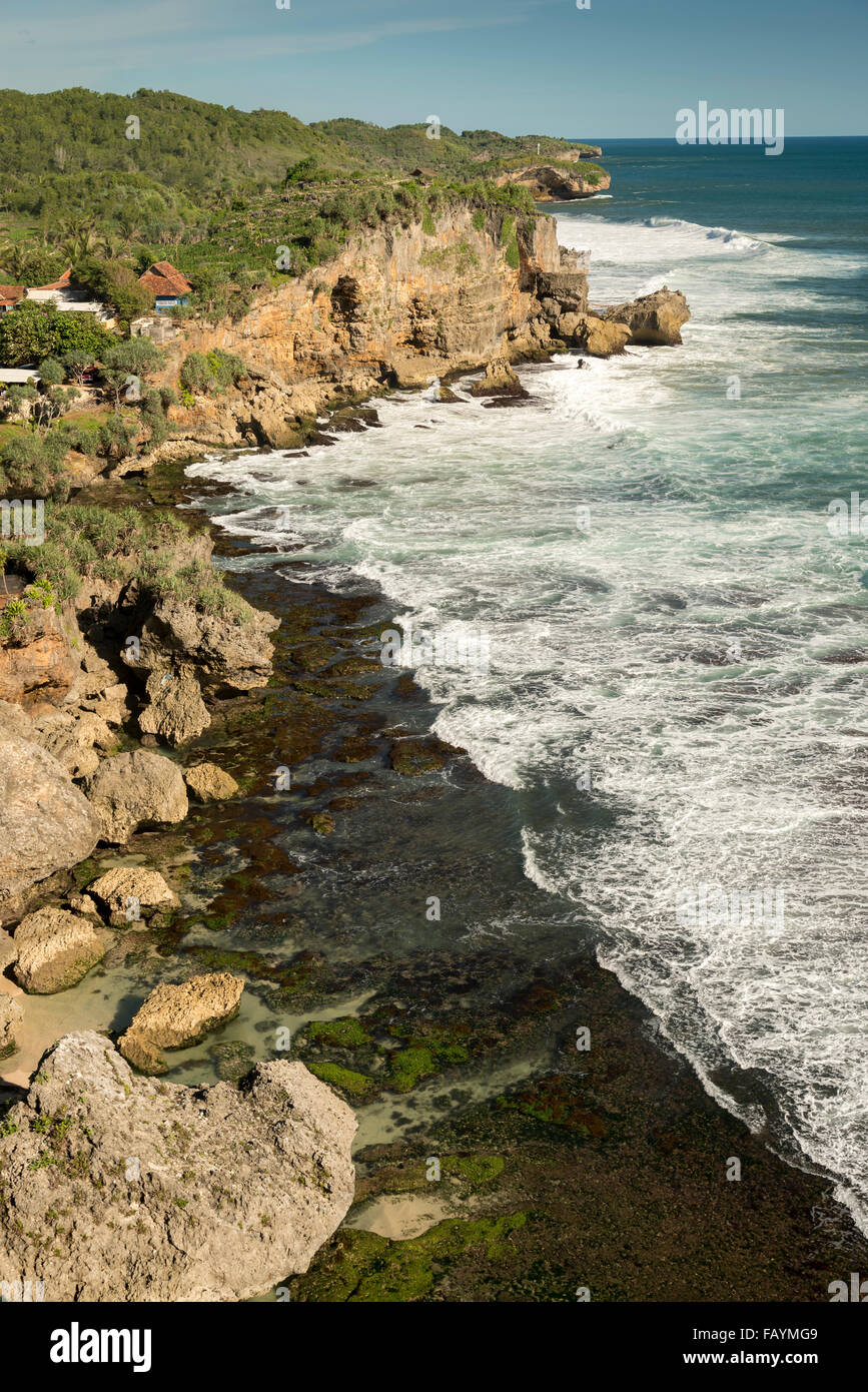 Rock clifs of insonesian seashore near the beach Ngobaran, Yogyakarta ...