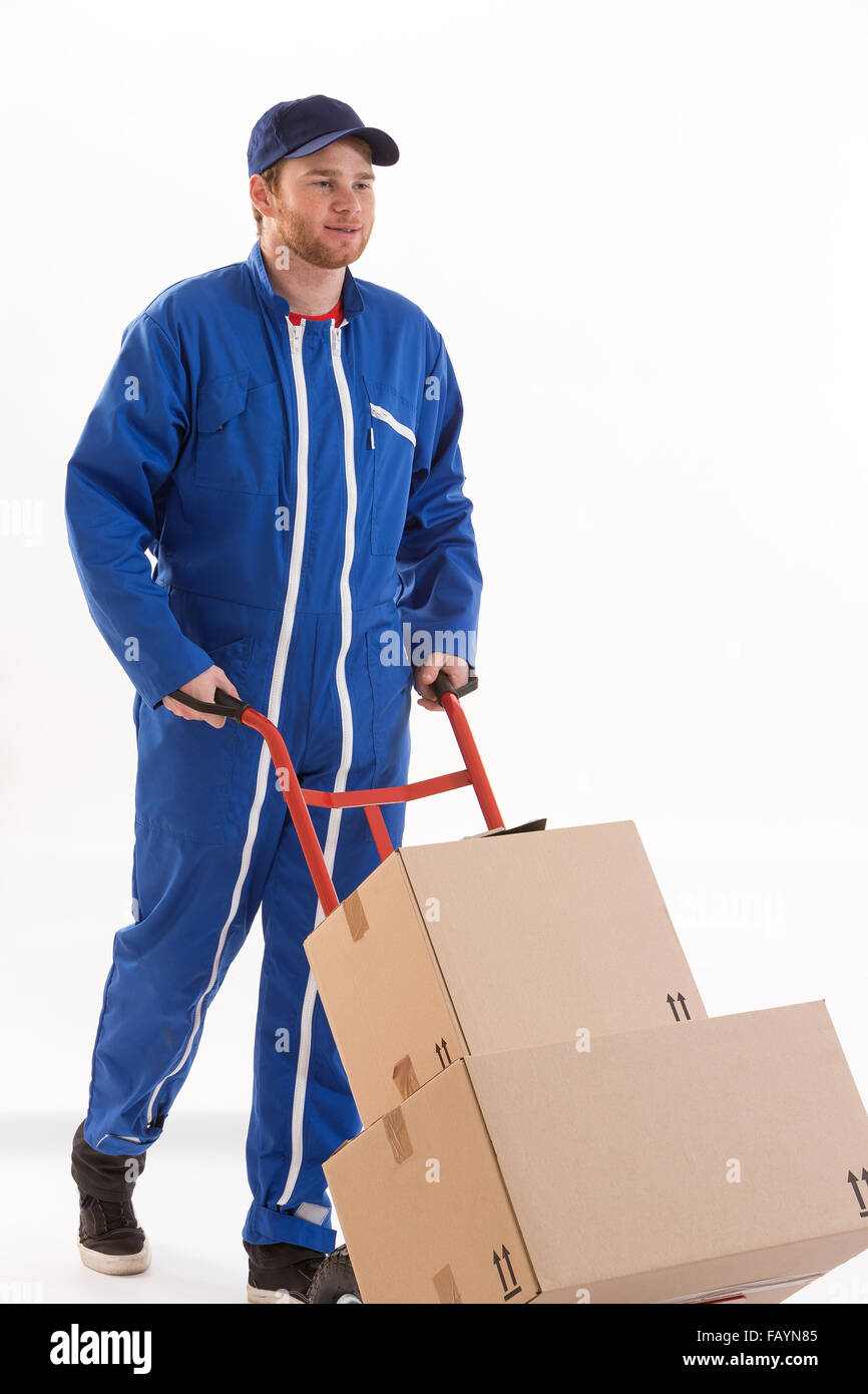 delivery man moving parcels with dolly Stock Photo - Alamy