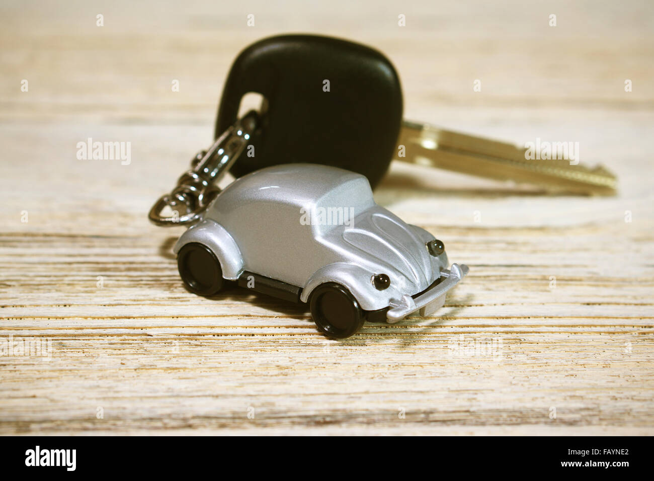 Car toy with car key on wood table Stock Photo - Alamy