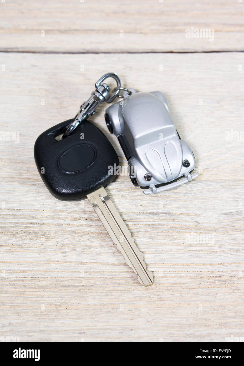 Car key with car toy on white wood table Stock Photo - Alamy