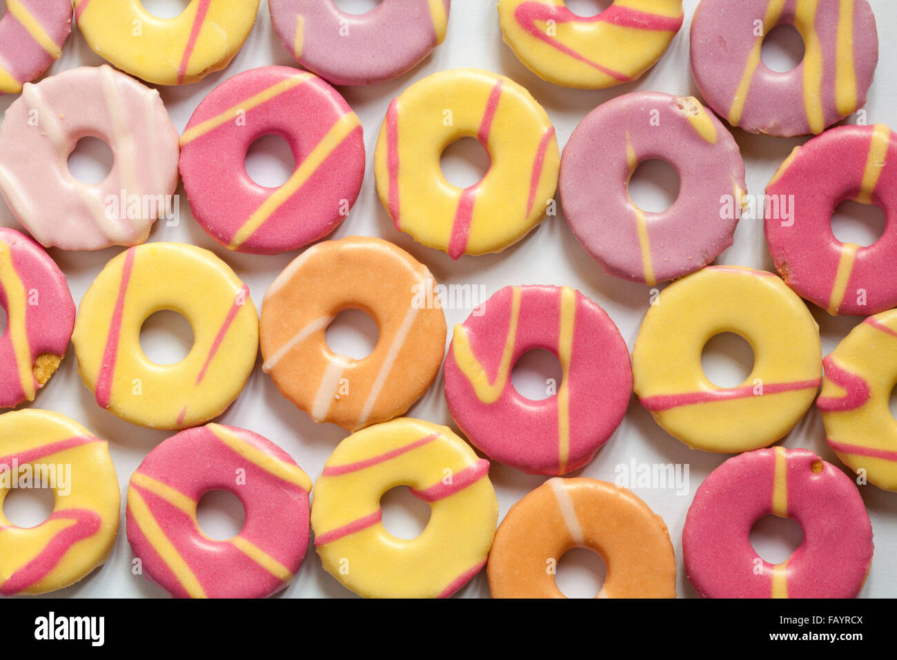 colourful spread of Fox's mini party rings biscuits set on white ...