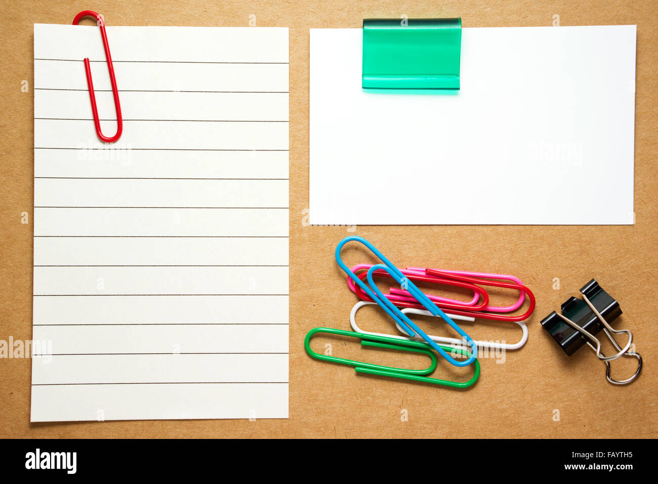 Business card with paperclips and note paper on brown cardboard Stock ...