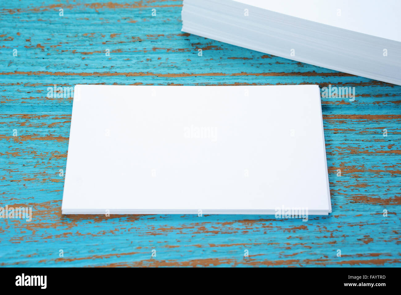 Blank business card on blue wood desk Stock Photo - Alamy