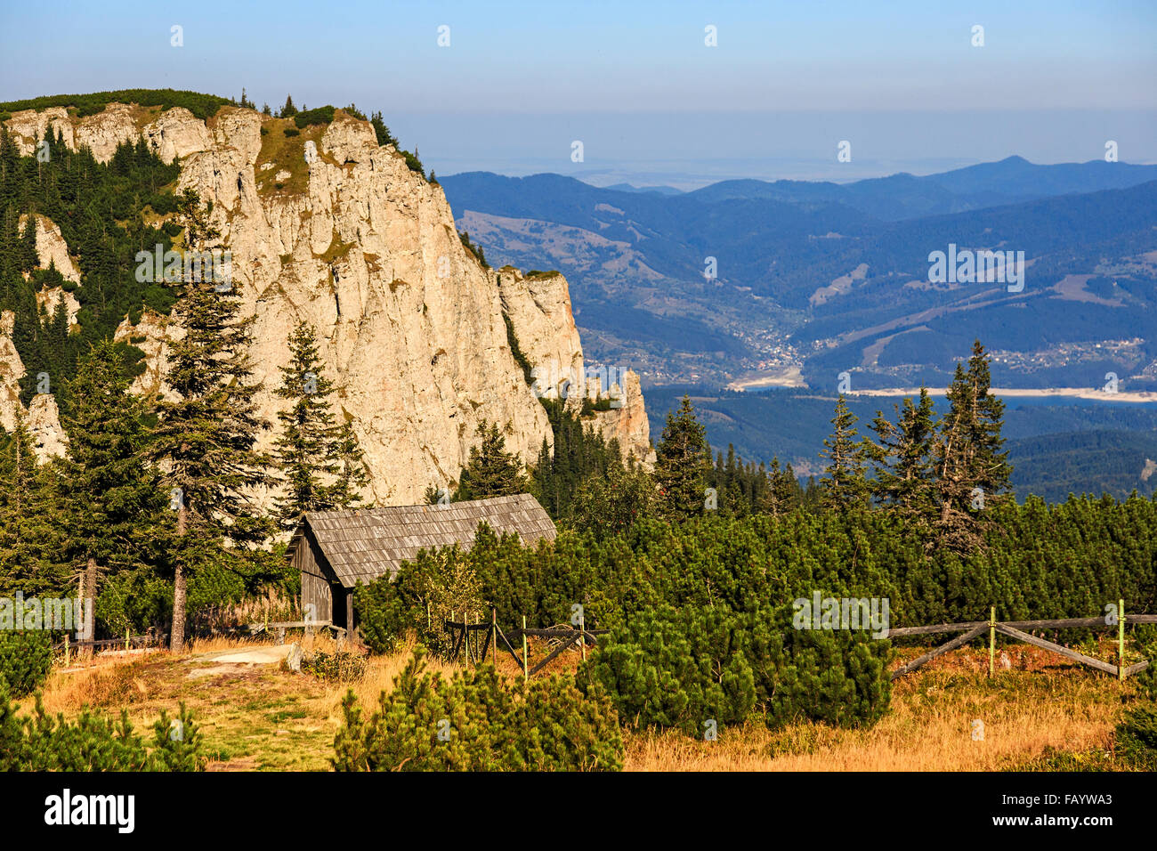 Wooden refuge in mountain landscape Stock Photo - Alamy