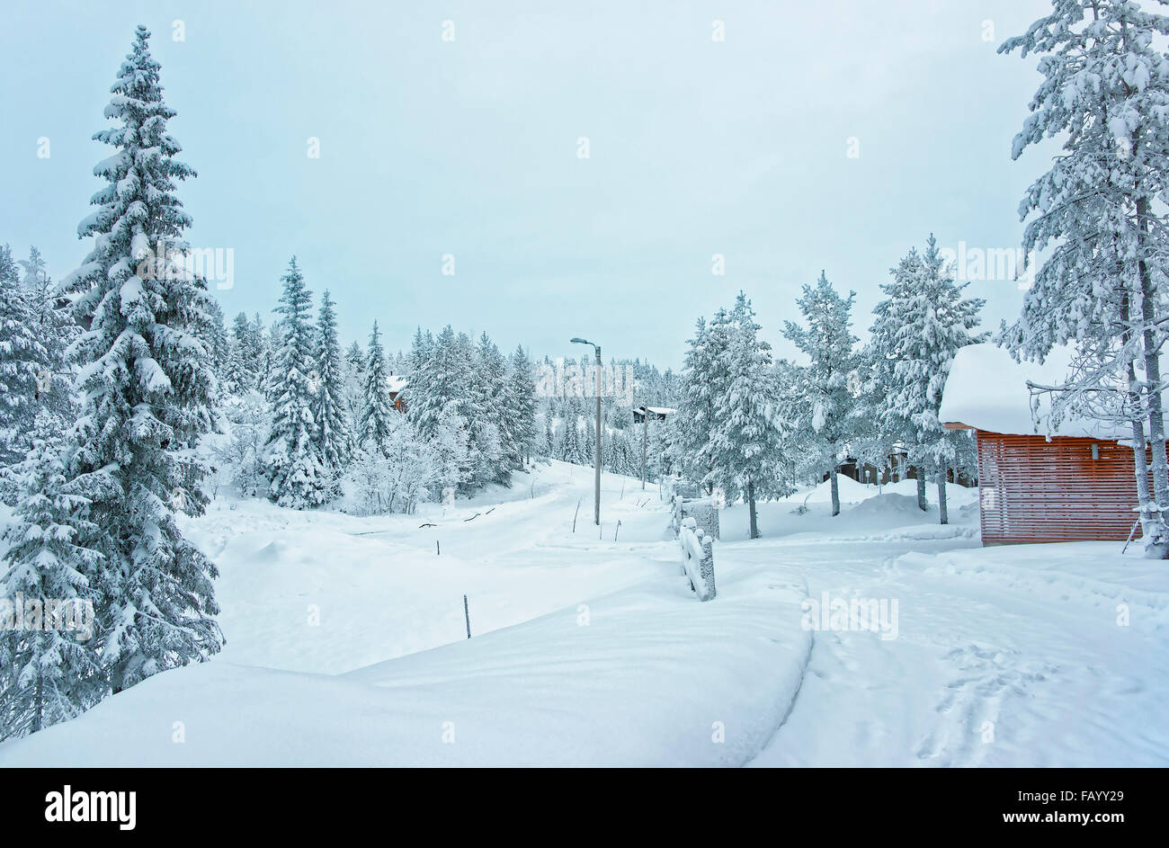 Cottages in the snow covered Ruka in Finland on the Arctic pole circle ...
