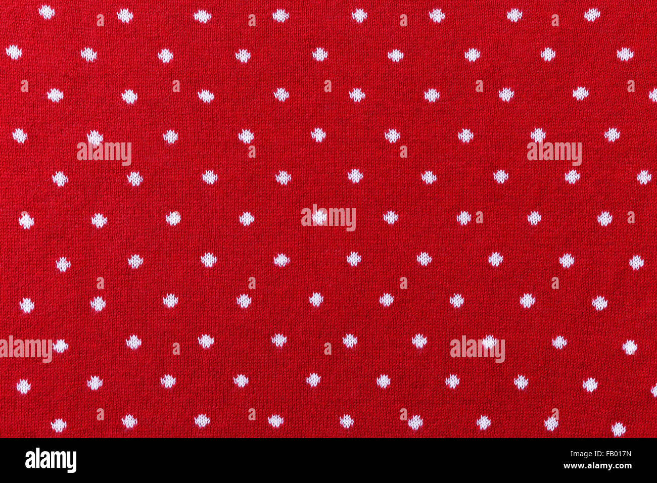 Red knit fabric with polka dot texture background Stock Photo - Alamy