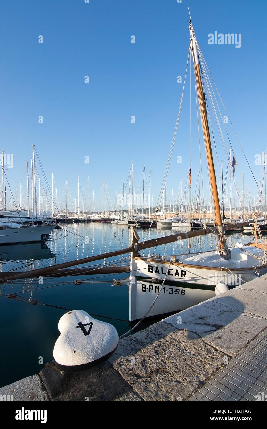 Marina with yachts, llaut and the word BALEAR and mooring knob and mast ...