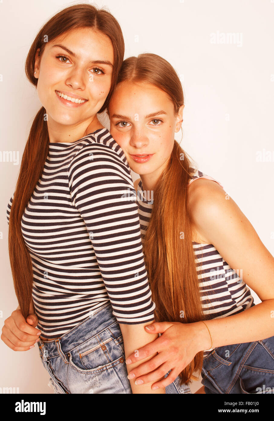 two cute teenagers having fun together isolated on white Stock Photo ...