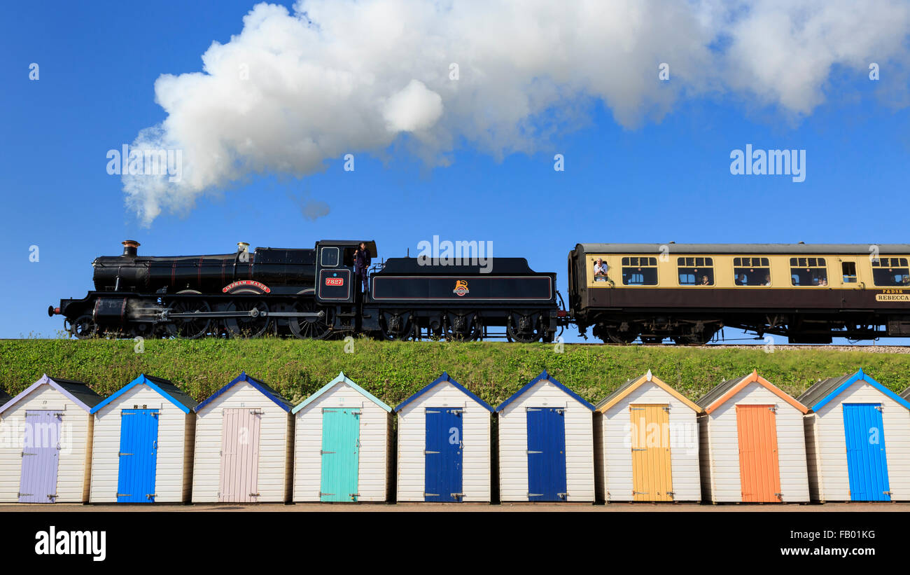 7827 Lydham Manor hauls a train past the beach huts of Goodrington ...