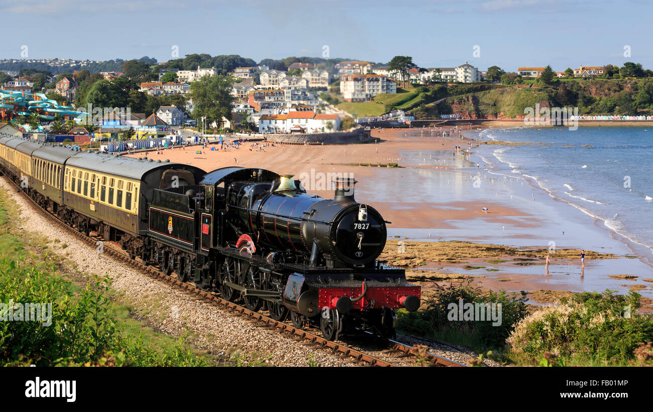 7827 Lydham Manor hauls a train past Goodrington Sands, Paignton, Devon ...