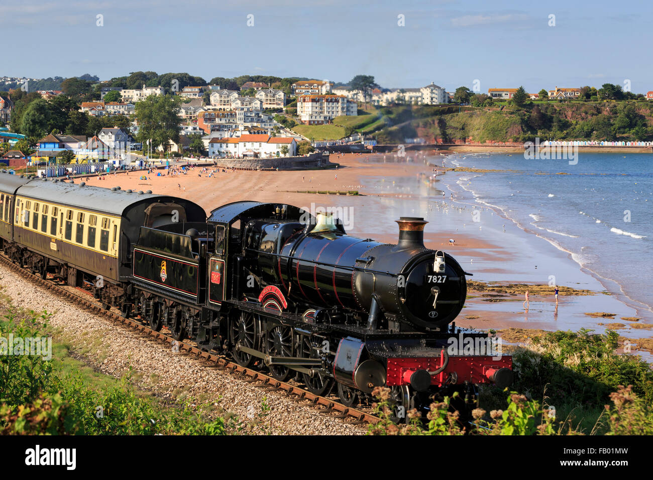 7827 Lydham Manor hauls a train past Goodrington Sands, Paignton, Devon ...