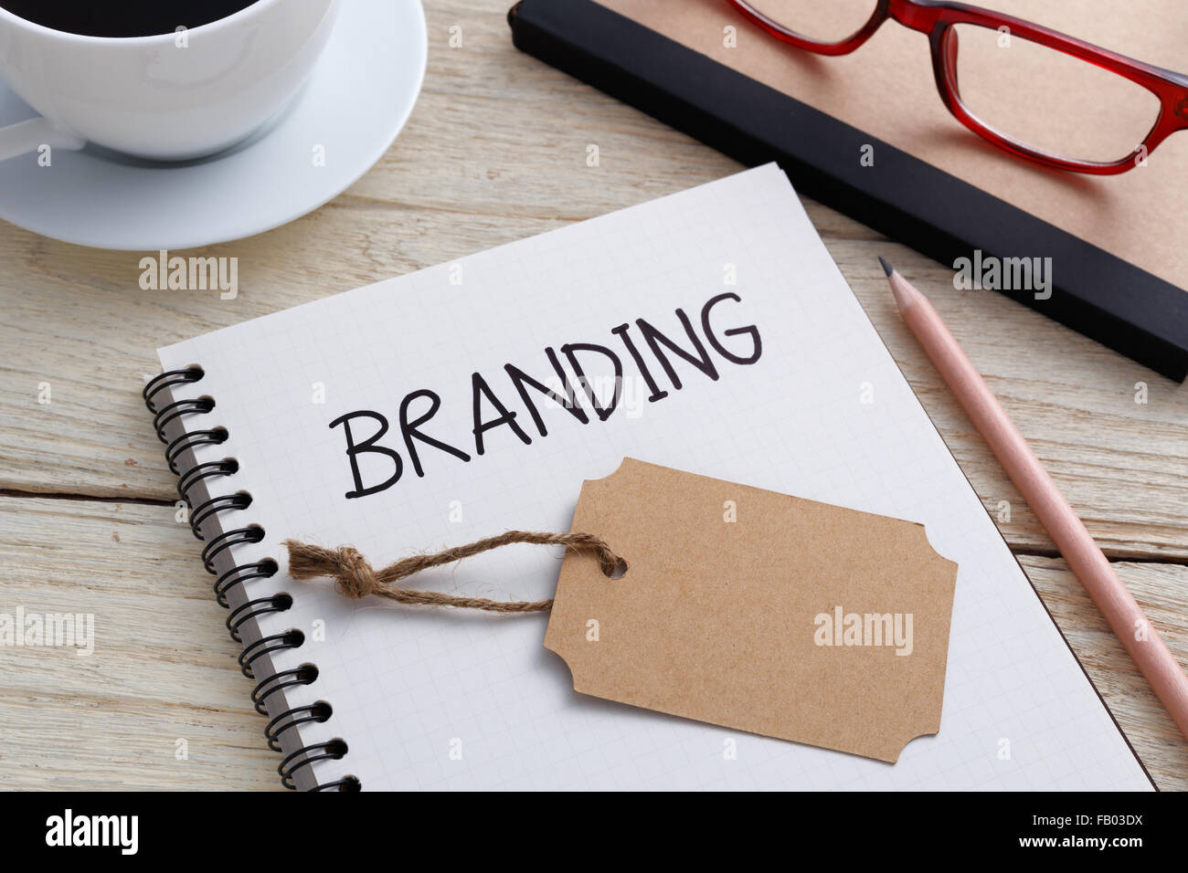 Branding concept with notebook and brand tag on work desk Stock Photo ...